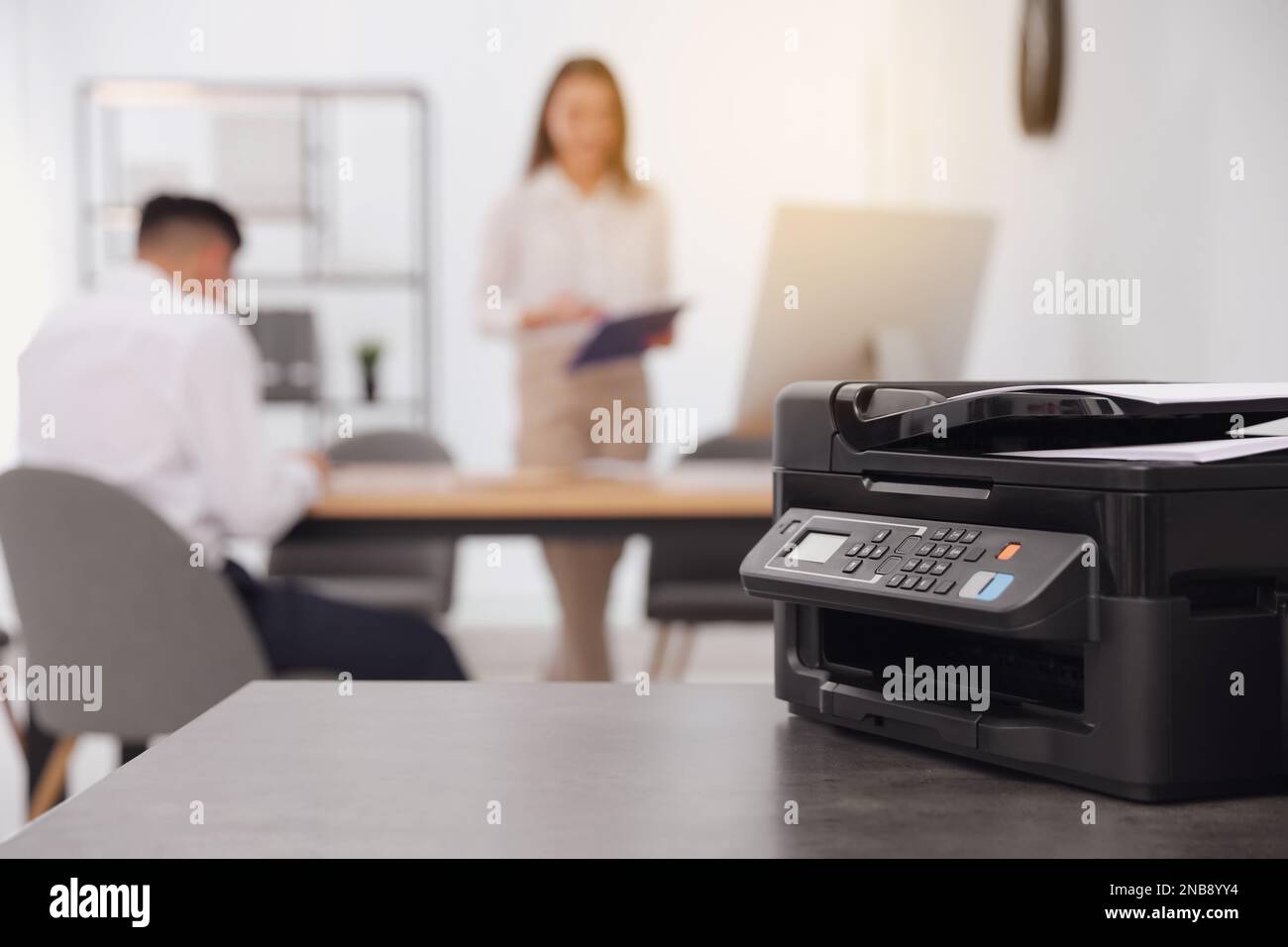 New modern printer on table in office. Space for text Stock Photo - Alamy