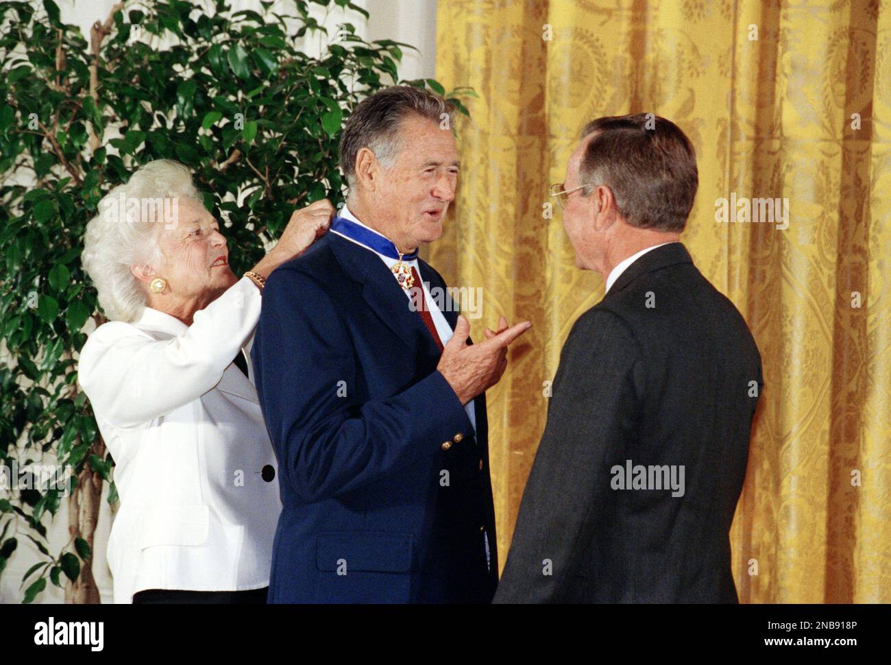 President George W. Bush, right, presents the Presidential Medal of ...