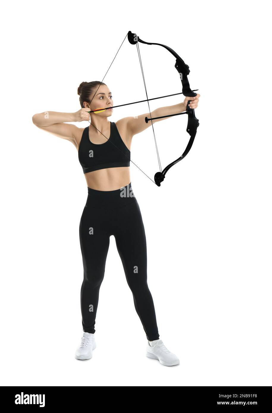 Woman with bow and arrow practicing archery on white background Stock ...