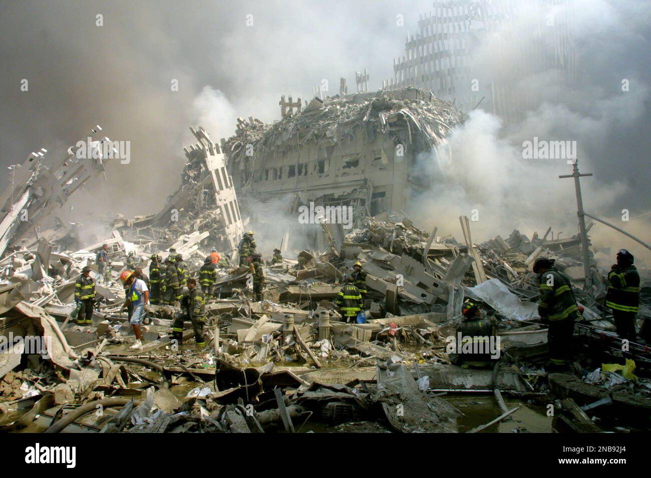 FILE - In this Tuesday, Sept. 11, 2001 file photo, firefighters walk ...