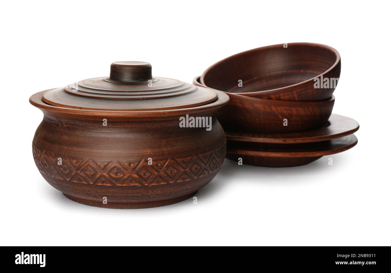 Set of stylish clay dishes on white background Stock Photo - Alamy