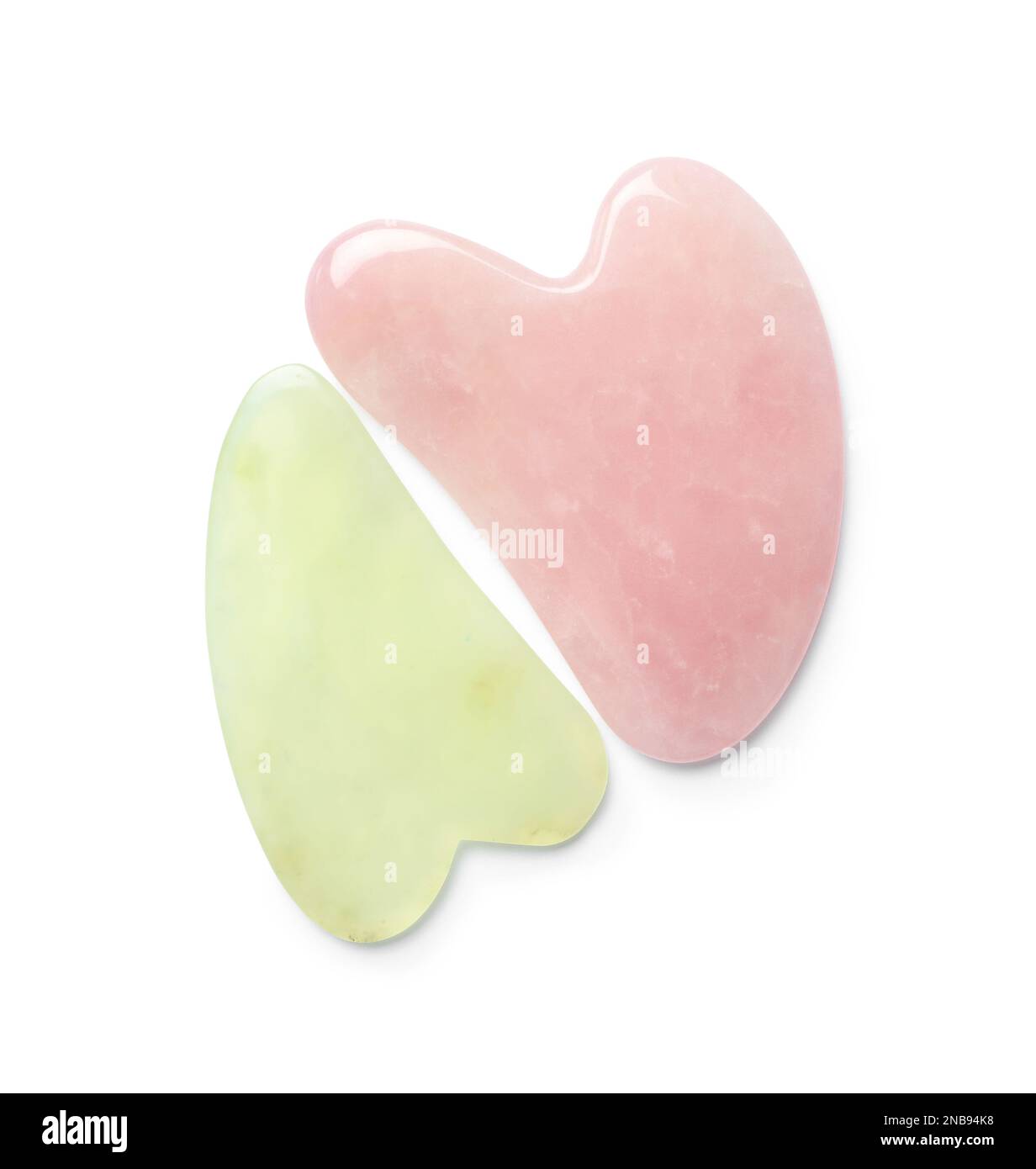 Jade and rose quartz gua sha tools on white background, top view Stock ...