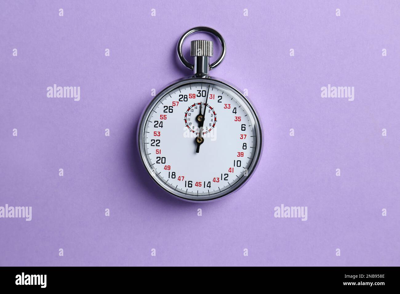 Vintage timer on violet background, top view Stock Photo - Alamy