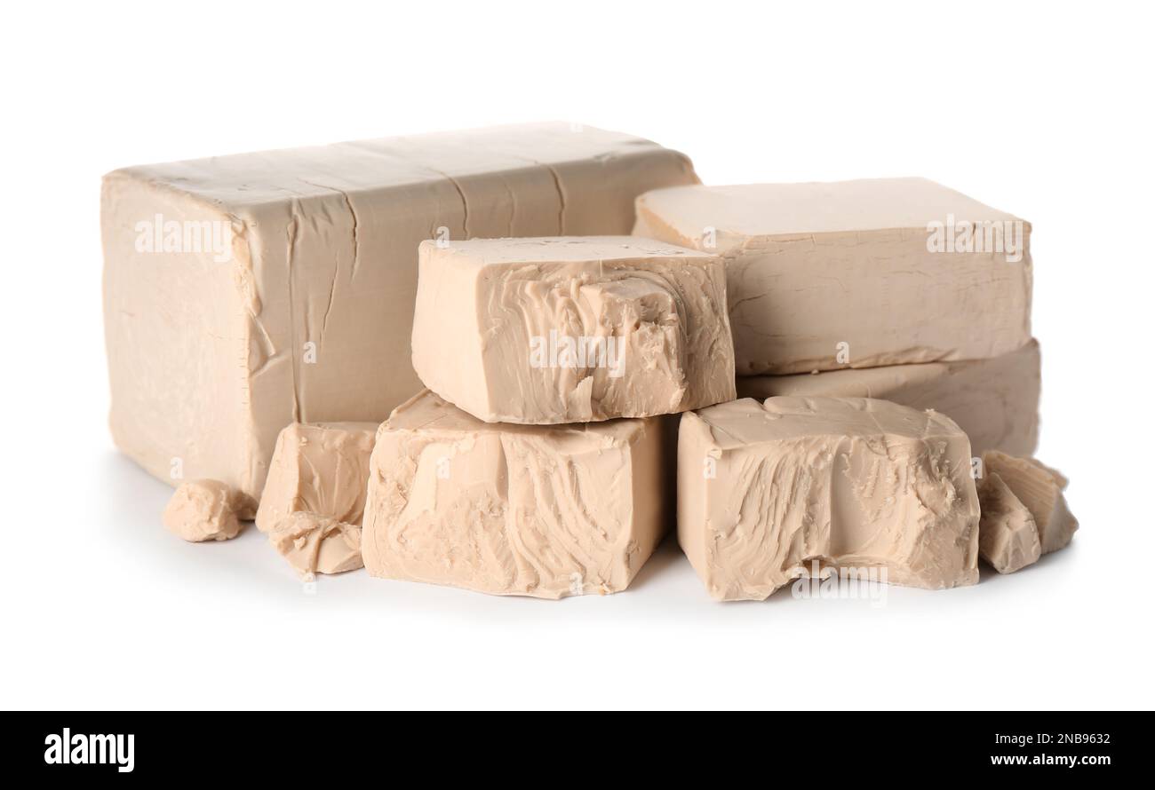 Pieces of compressed yeast on white background Stock Photo - Alamy