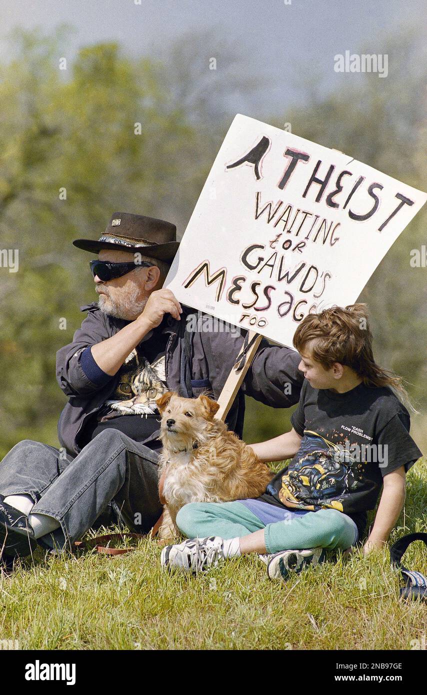 Max Bell of Prescott Valley, Arizona, sits with his son Alex and dog ...