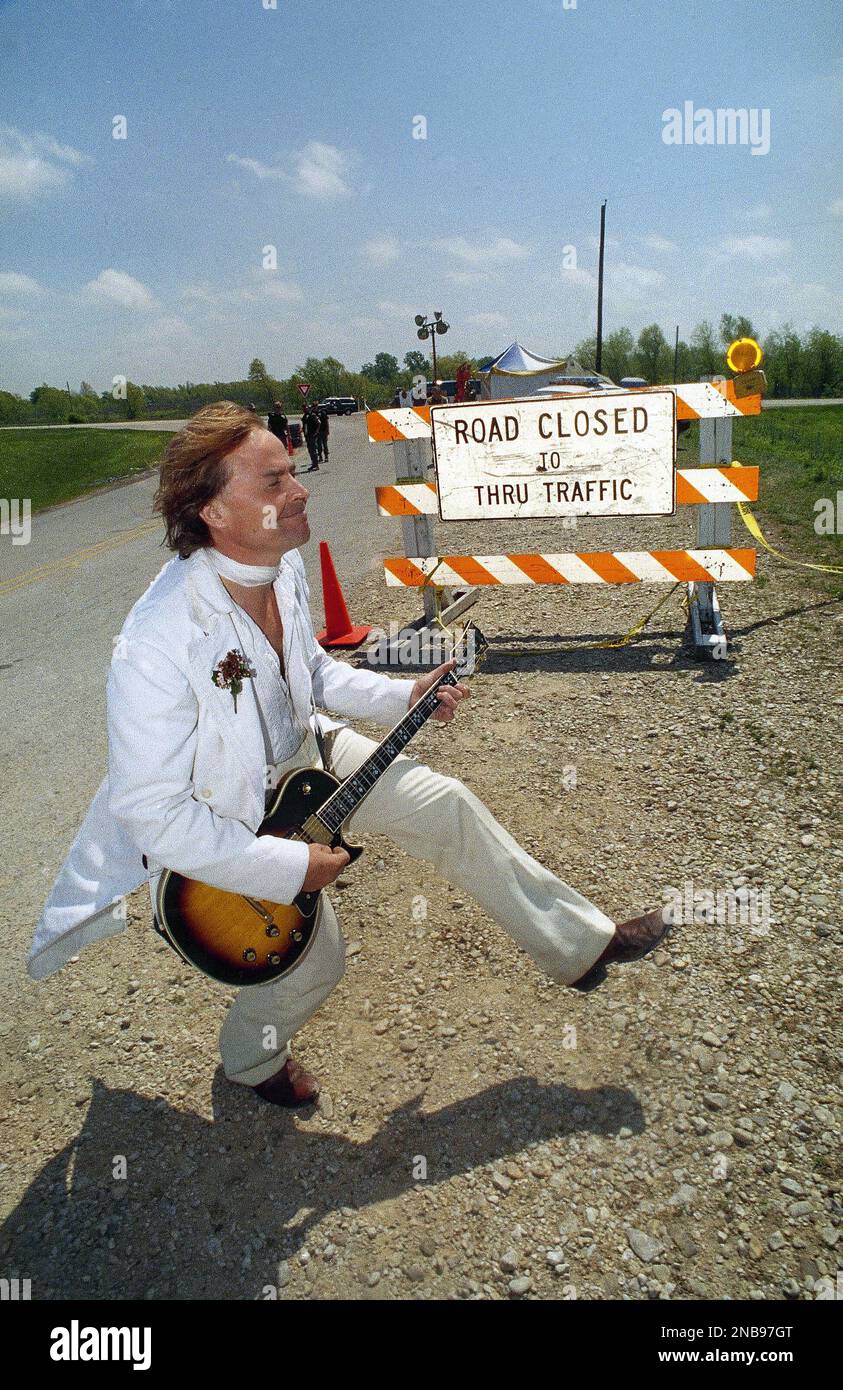 Gregory Bruce Hering, 42, of Fairbanks, Alaska, plays a guitar outside ...