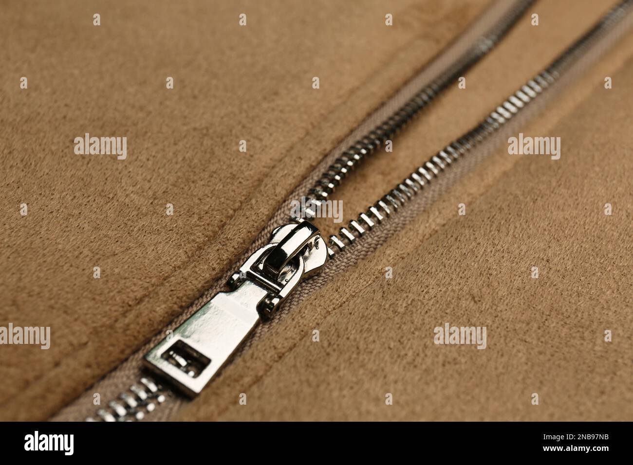 Beige jacket with zipper as background, closeup view Stock Photo - Alamy