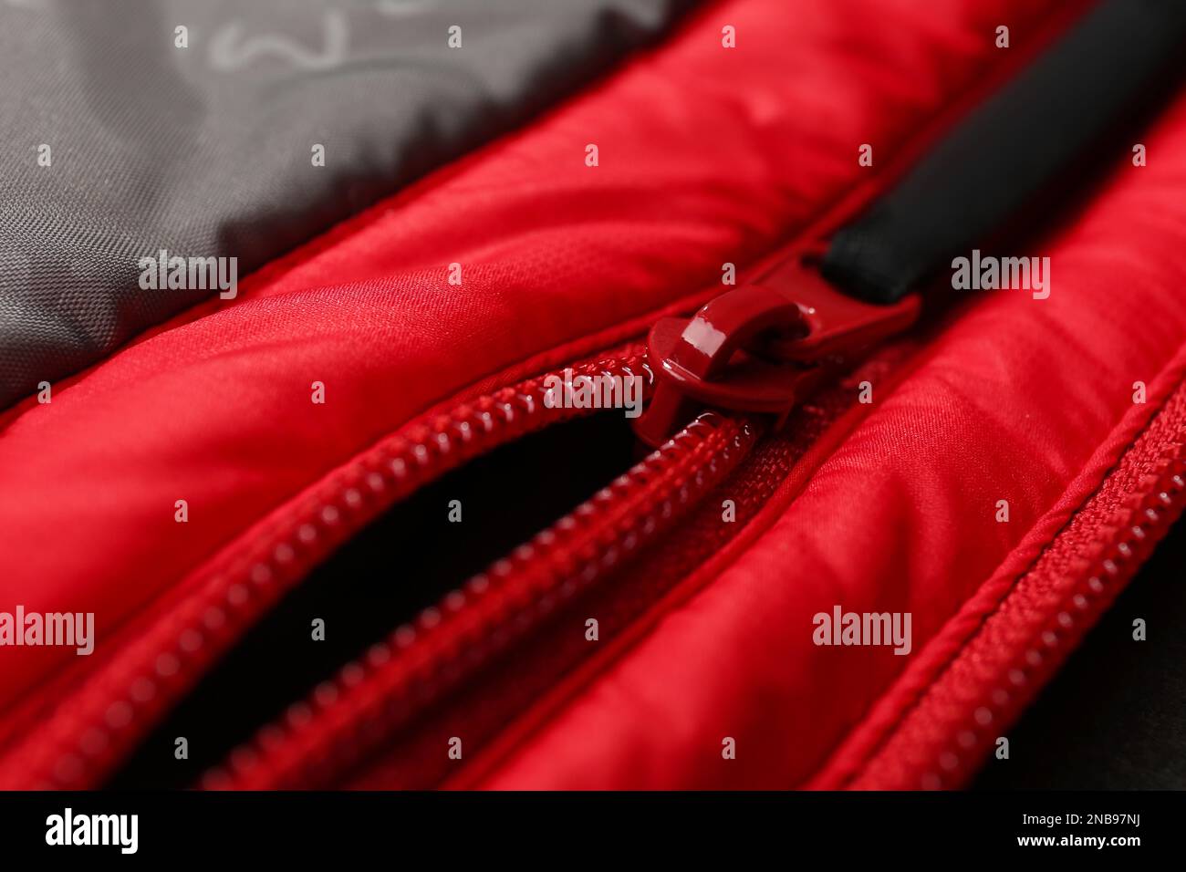 Red jacket with zipper as background, closeup view Stock Photo - Alamy