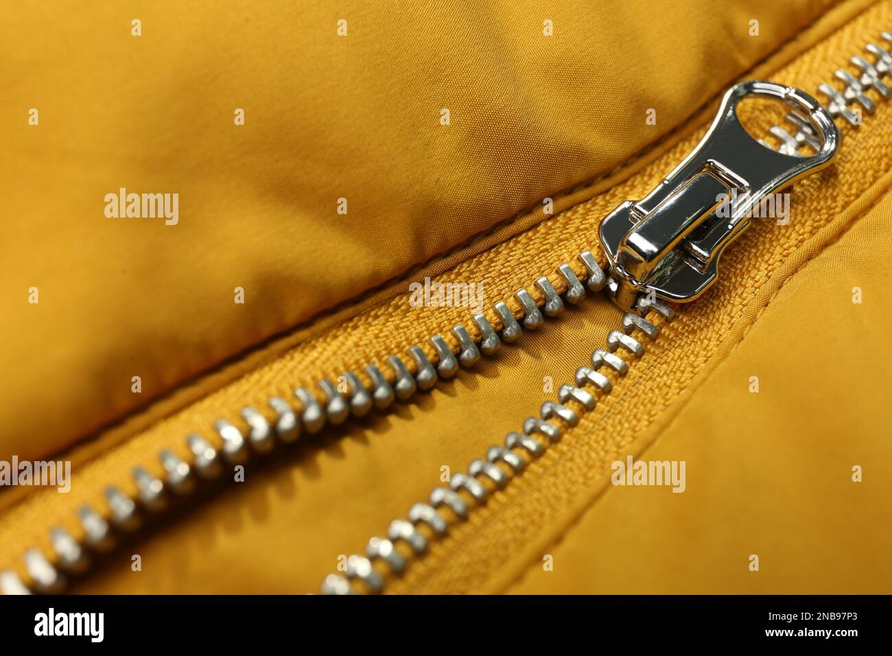Yellow jacket with zipper as background, closeup view Stock Photo - Alamy