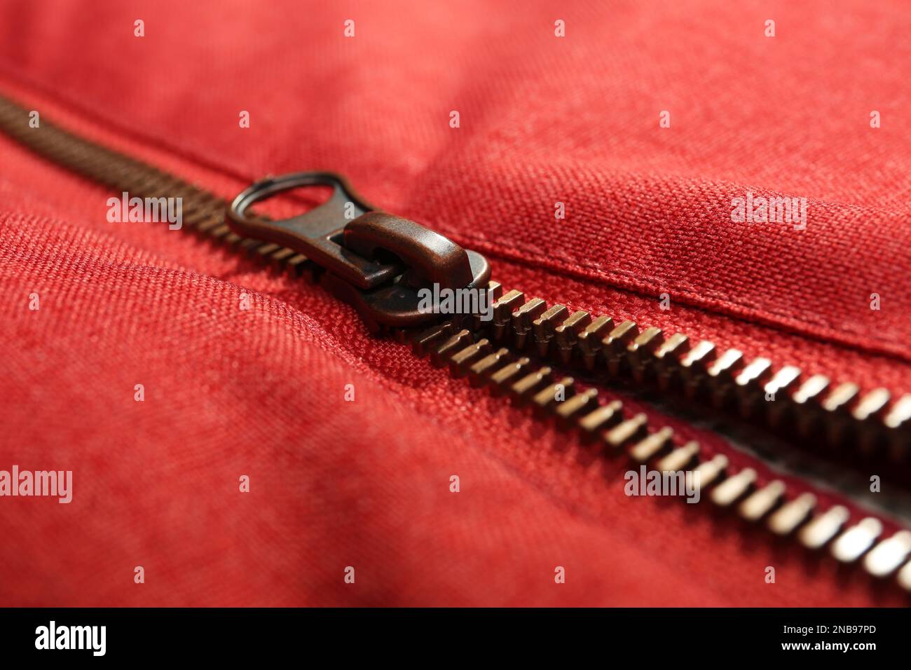 Red fabric with zipper as background, closeup view Stock Photo - Alamy