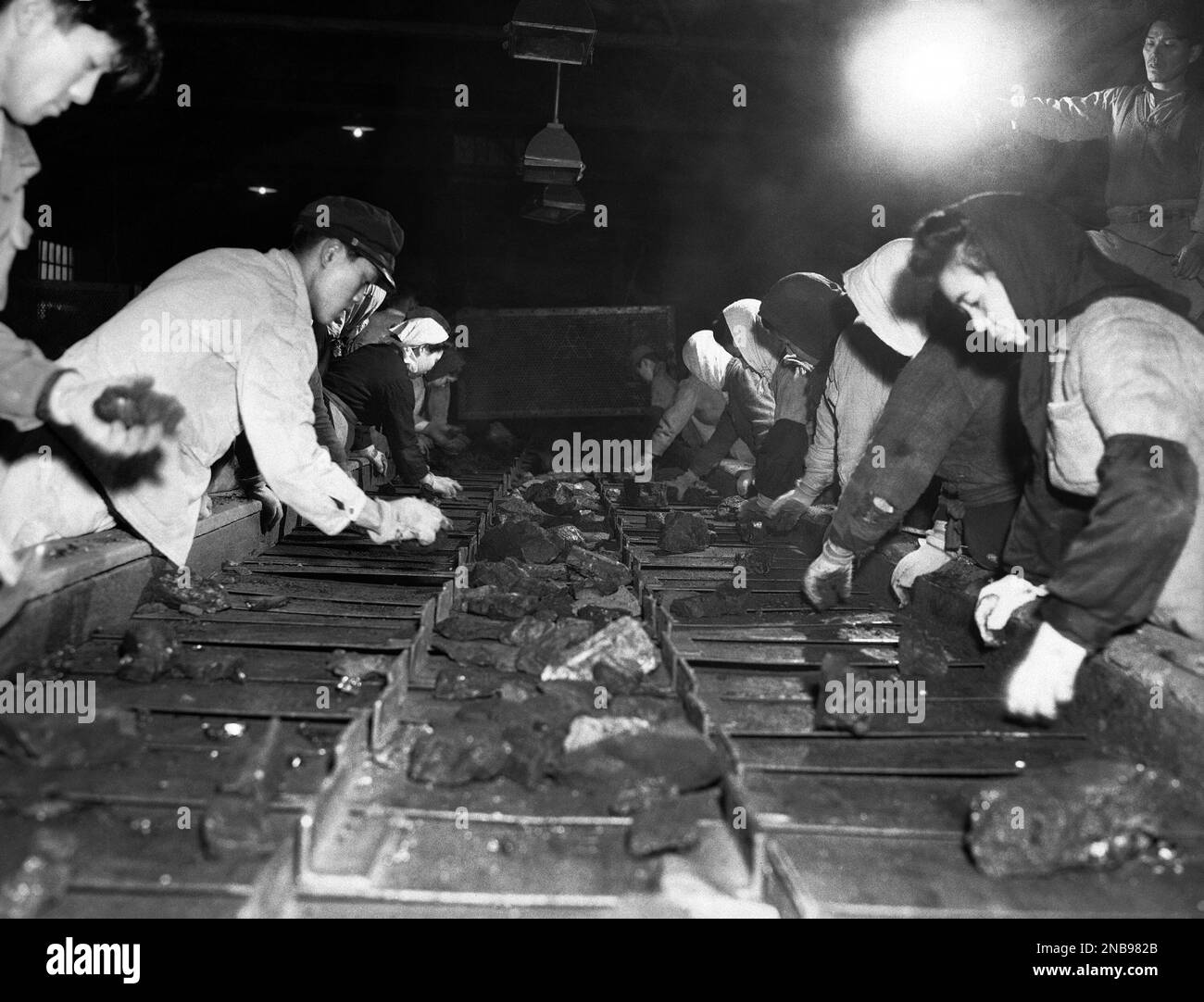 In this sorting room of a coal mine on the island of Hokkaido, Japan on ...