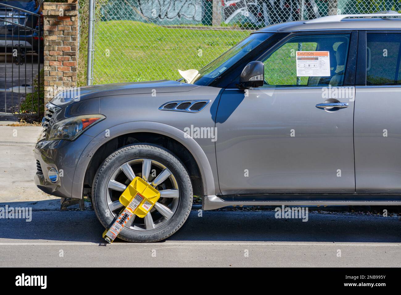 NEW ORLEANS, LA, USA - FEBRUARY 12, 2023: Car booted and ticketed on ...