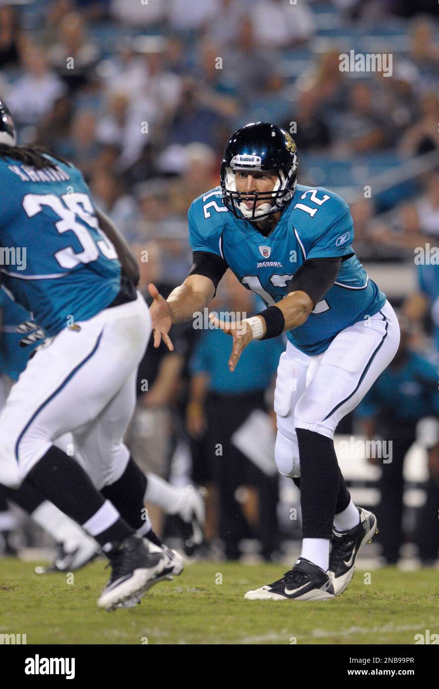 Jacksonville Jaguars quarterback Luke McCown (12), right, tosses the ...