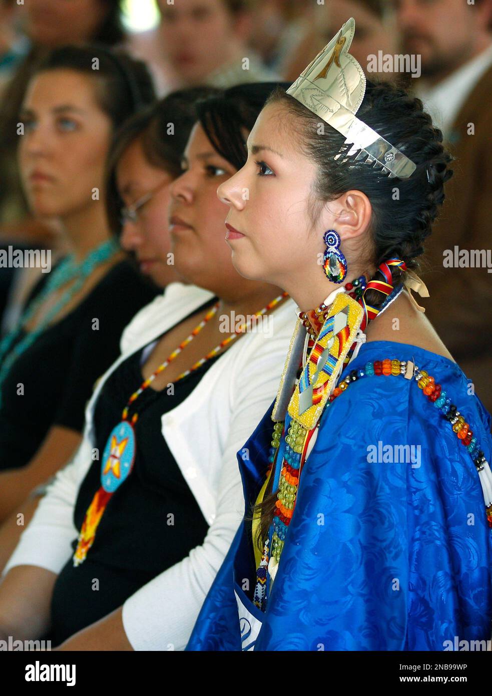 Victoria Korrect, Miss Indian Oklahoma City University, listens as the ...