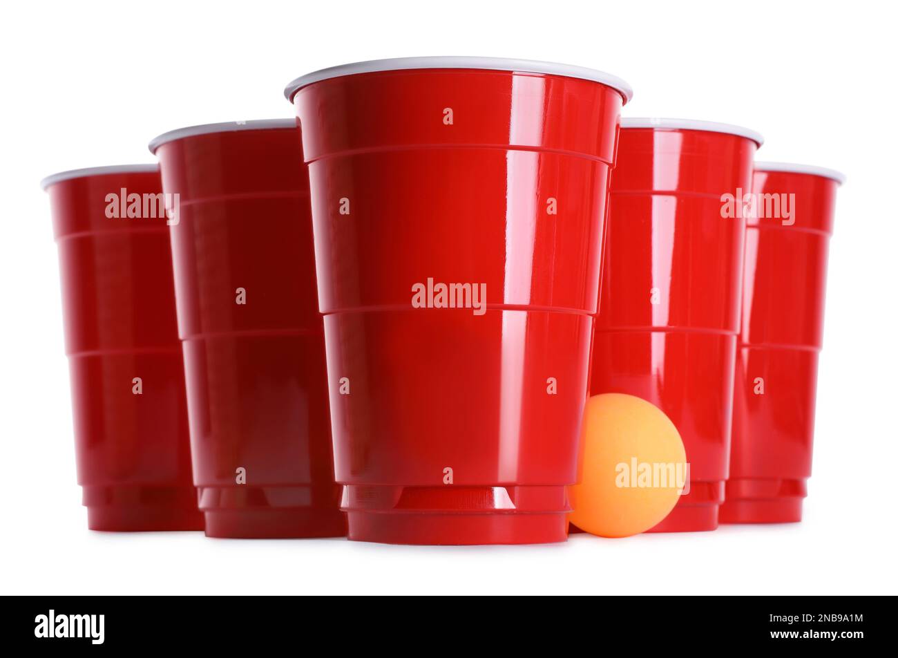 Plastic cups and ball for beer pong on white background Stock Photo - Alamy