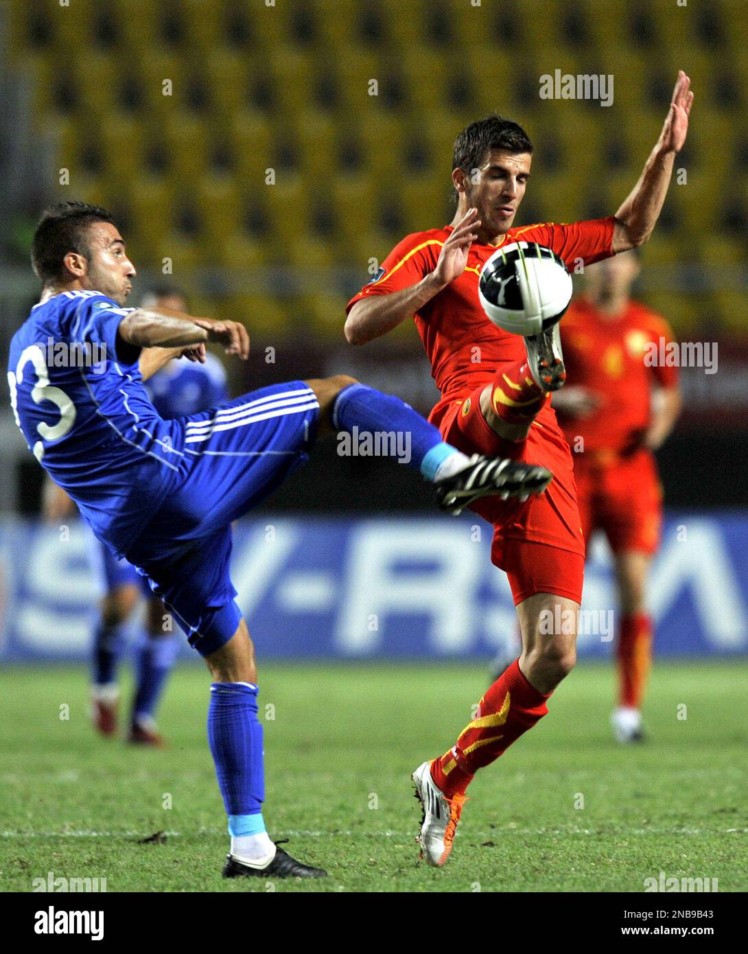 Macedonia's Ferhan Hasani, right, challenges with Andorra's Jordi Rubio ...