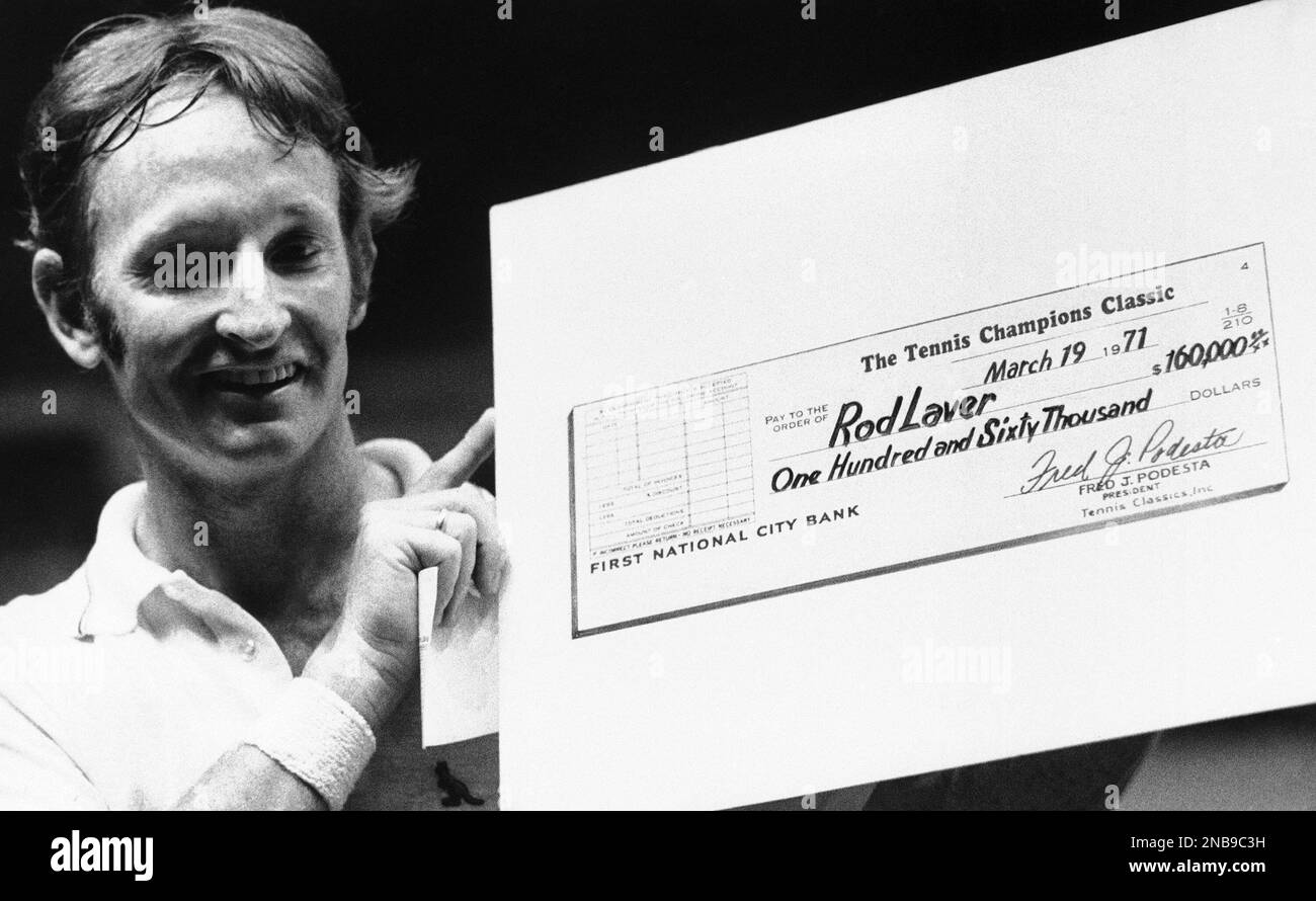 Rod Laver, of Australia, displays a facsimile of the $160,000 check ...