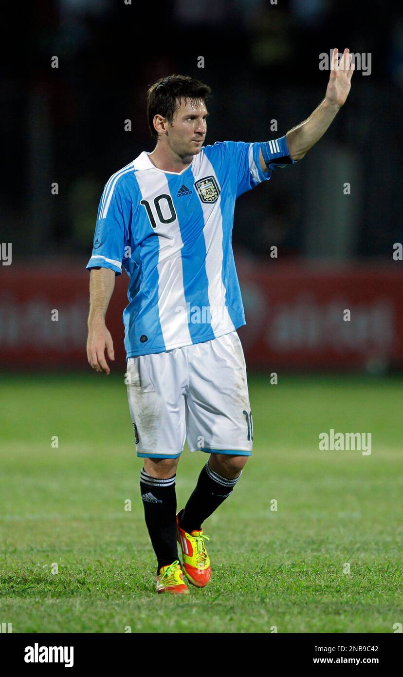Argentina's Lionel Messi waves to the crowd after a friendly soccer ...