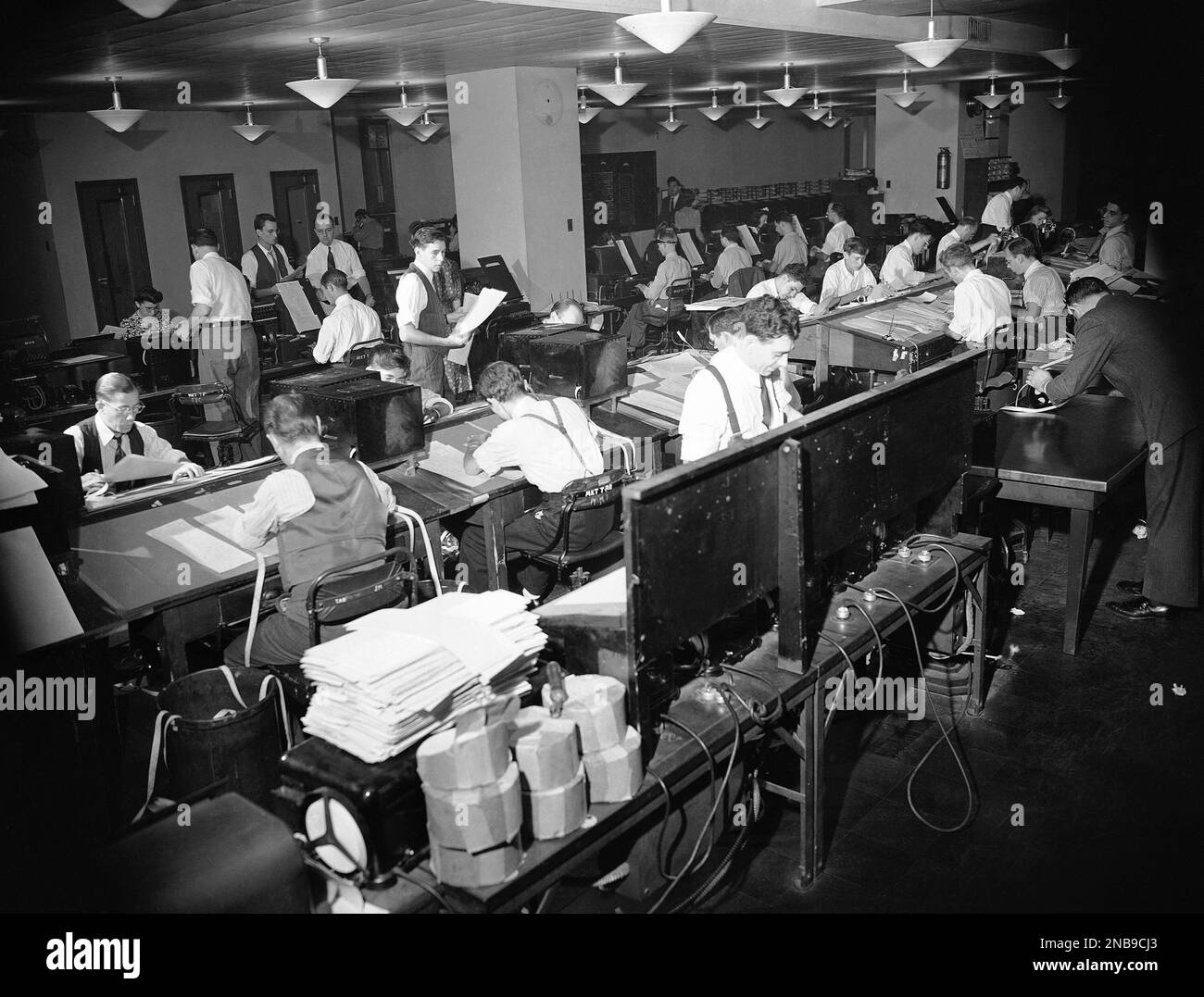 Associated Press staffers work on the general desk, Sept. 18, 1942. (AP ...