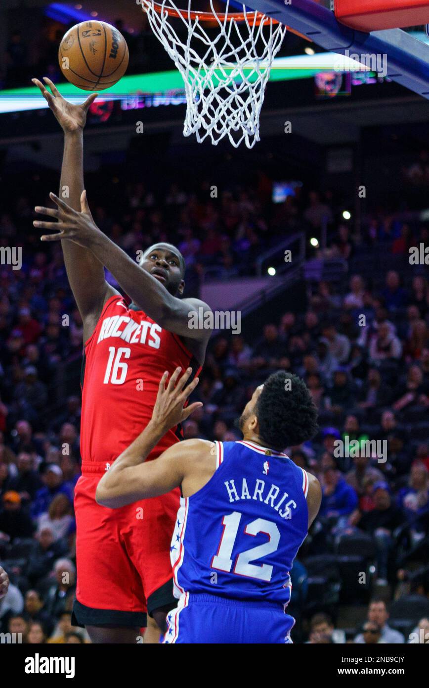 Houston Rockets' Daishen Nix, left, shoots the ball over Philadelphia ...