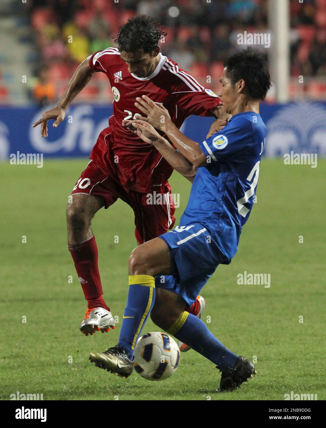 Thailand's Jakkaphan Kaewprom, right, is challenged by Amad Ali ...