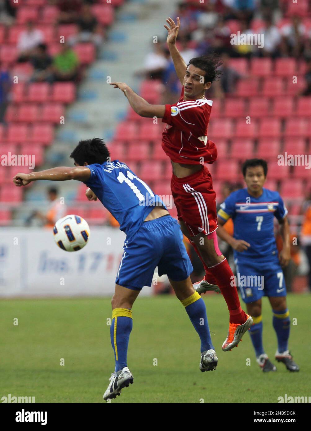 Thailand's Rangsan Vivatchaichok, left, clashes with Amad Ali Sulaiman ...