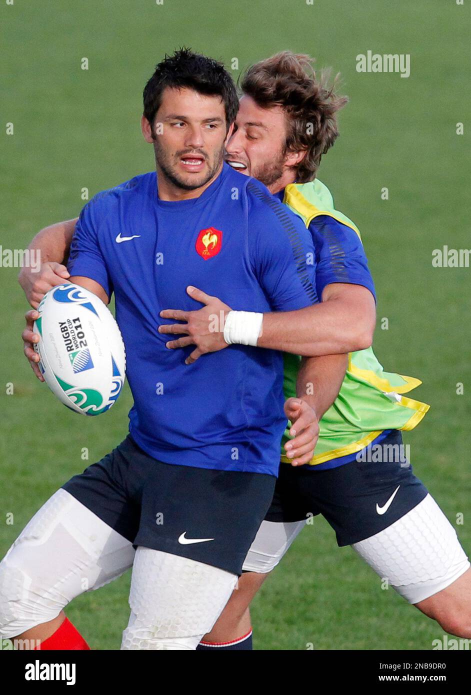 France's rugby team player Maxime Medard, right, catches Fabrice ...