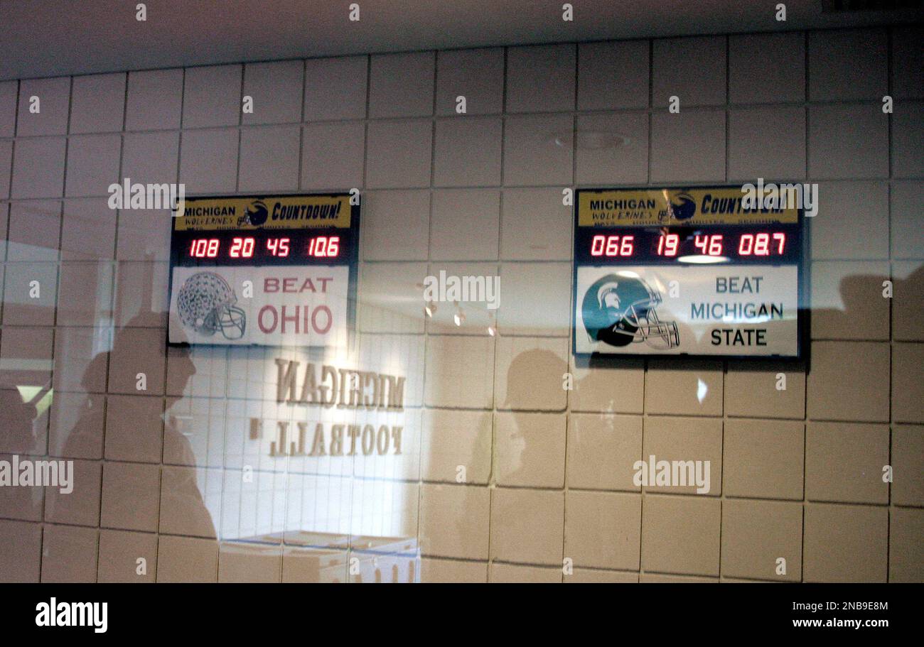 FILE - In this Aug. 9, 2011, file photo, clocks tracking the countdown ...