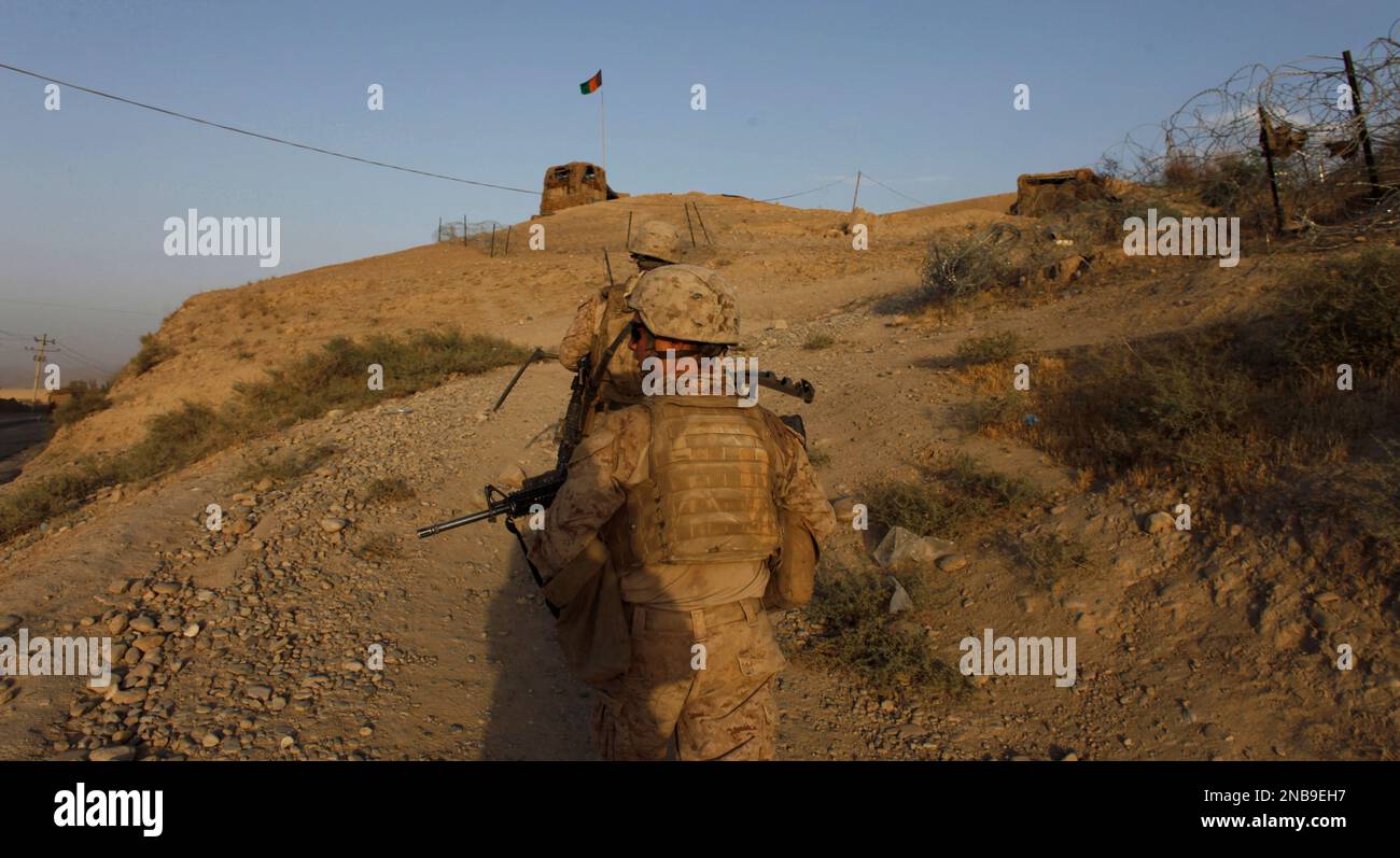 A U.S. Marine explosives sweeper and his point man from Charlie Company ...
