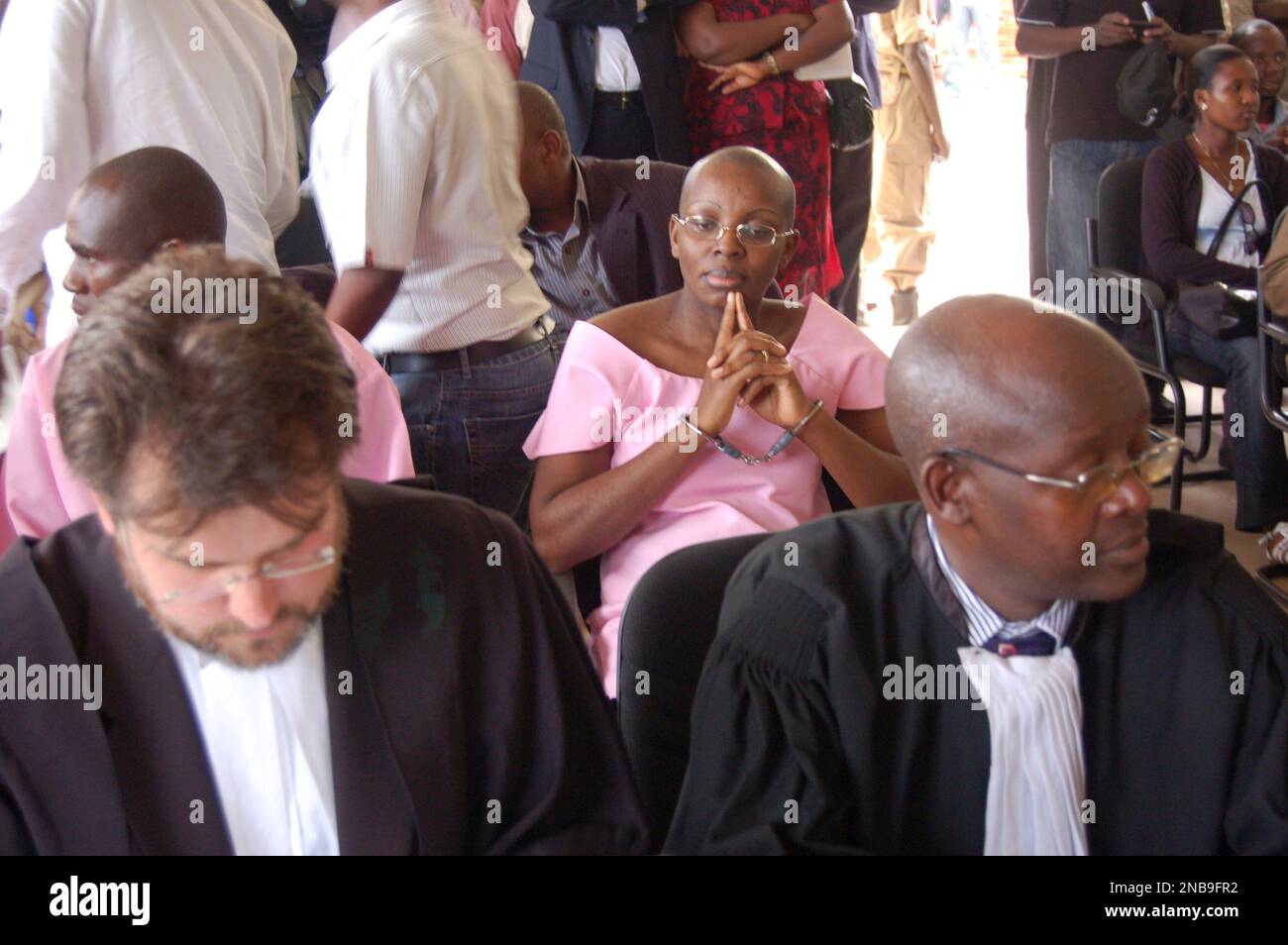 Rwandan opposition leader Victoire Ingabire, middle, sits pensively ...