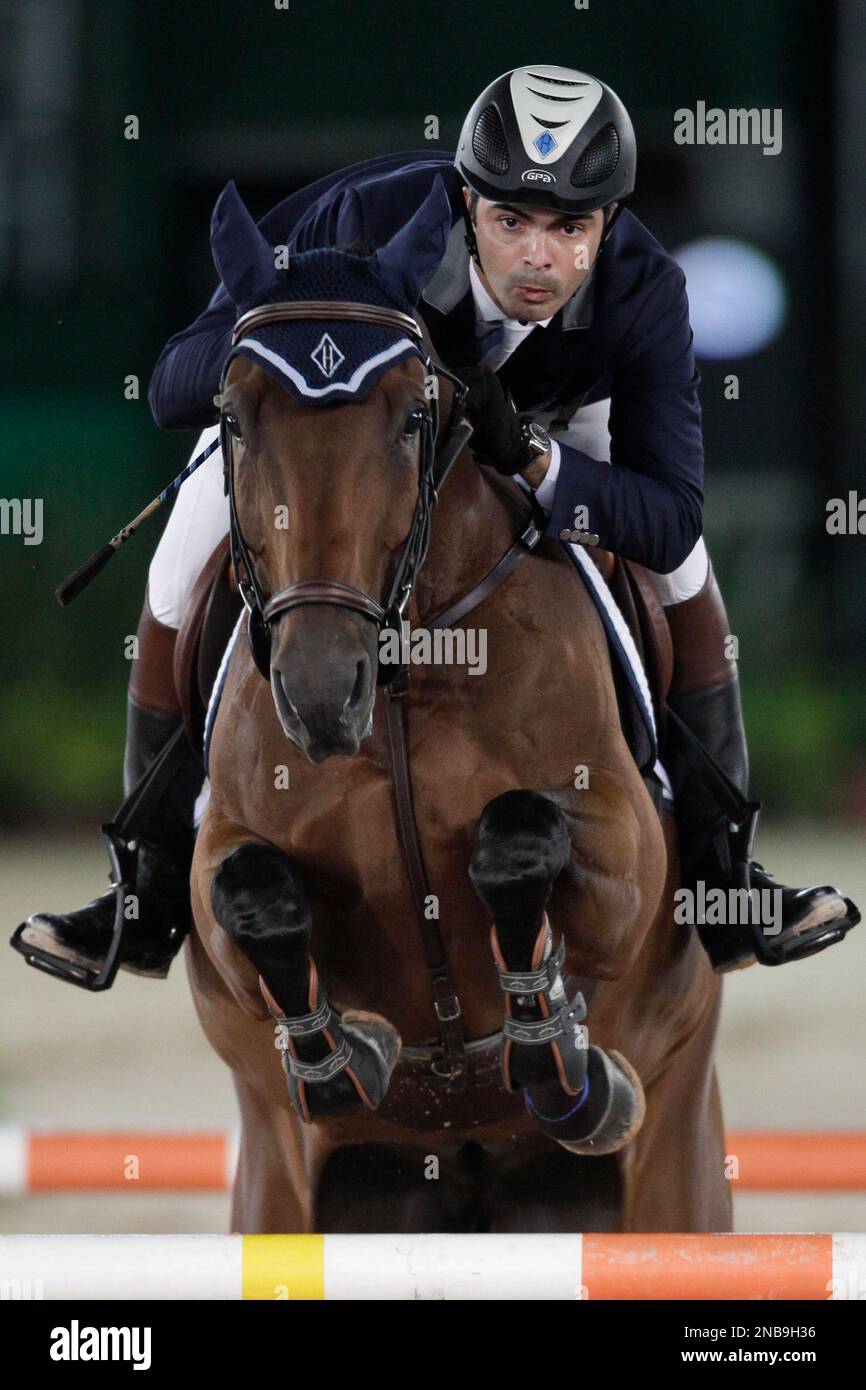 Brazil's Rodrigo Pessoa, riding "Let's Fly," clears a jump during the ...
