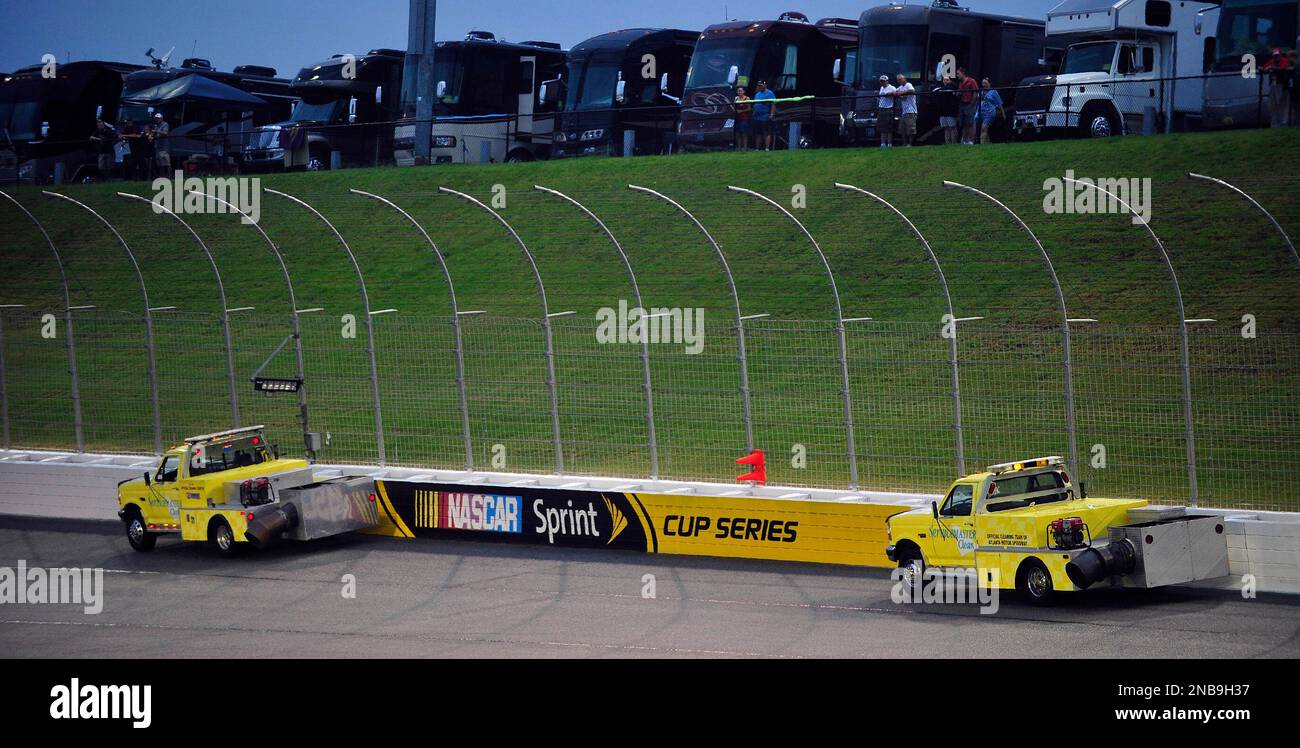 Drying trucks attempt to dry the track before the NASCAR Atlanta Sprint ...