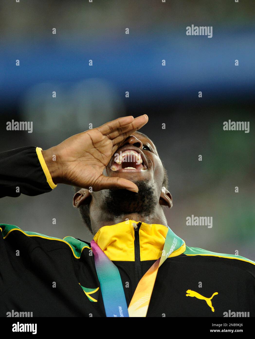 Jamaica's Usain Bolt celebrates on the podium after receiving his gold ...
