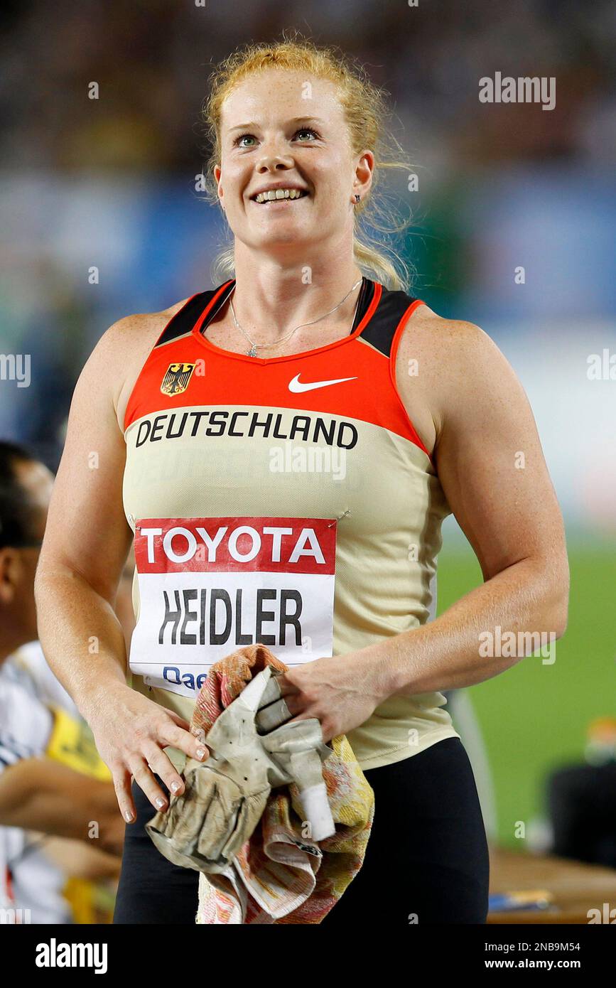 Germany's Betty Heidler celebrates after taking the silver medal in the ...