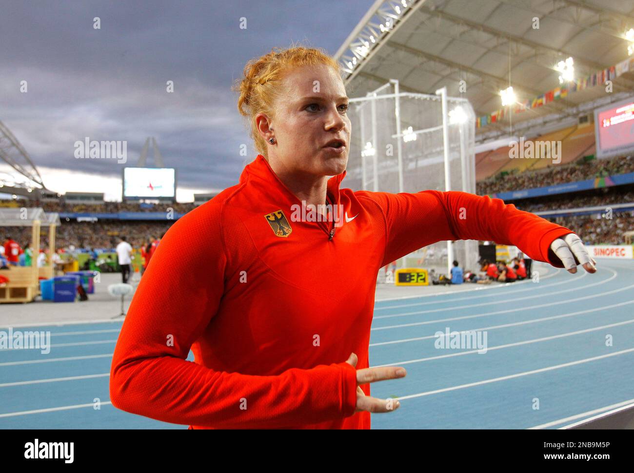 Germany's Betty Heidler talks to her coach before the Women's Hammer ...