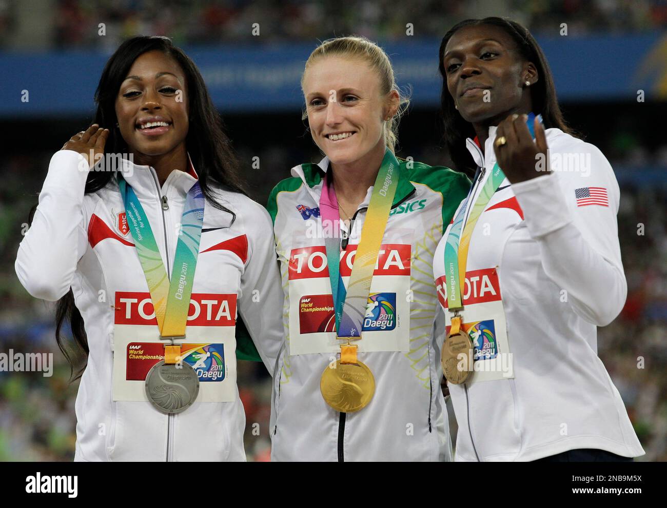 Australia's Sally Pearson, center, USA's Danielle Carruthers, left, and ...