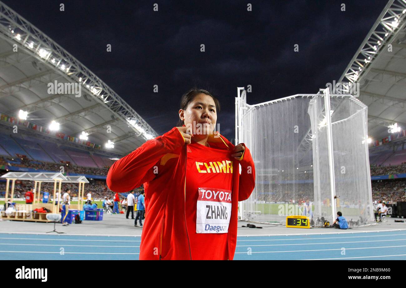 China's Zhang Wenxiu reacts as she competes in the Women's Hammer Throw ...