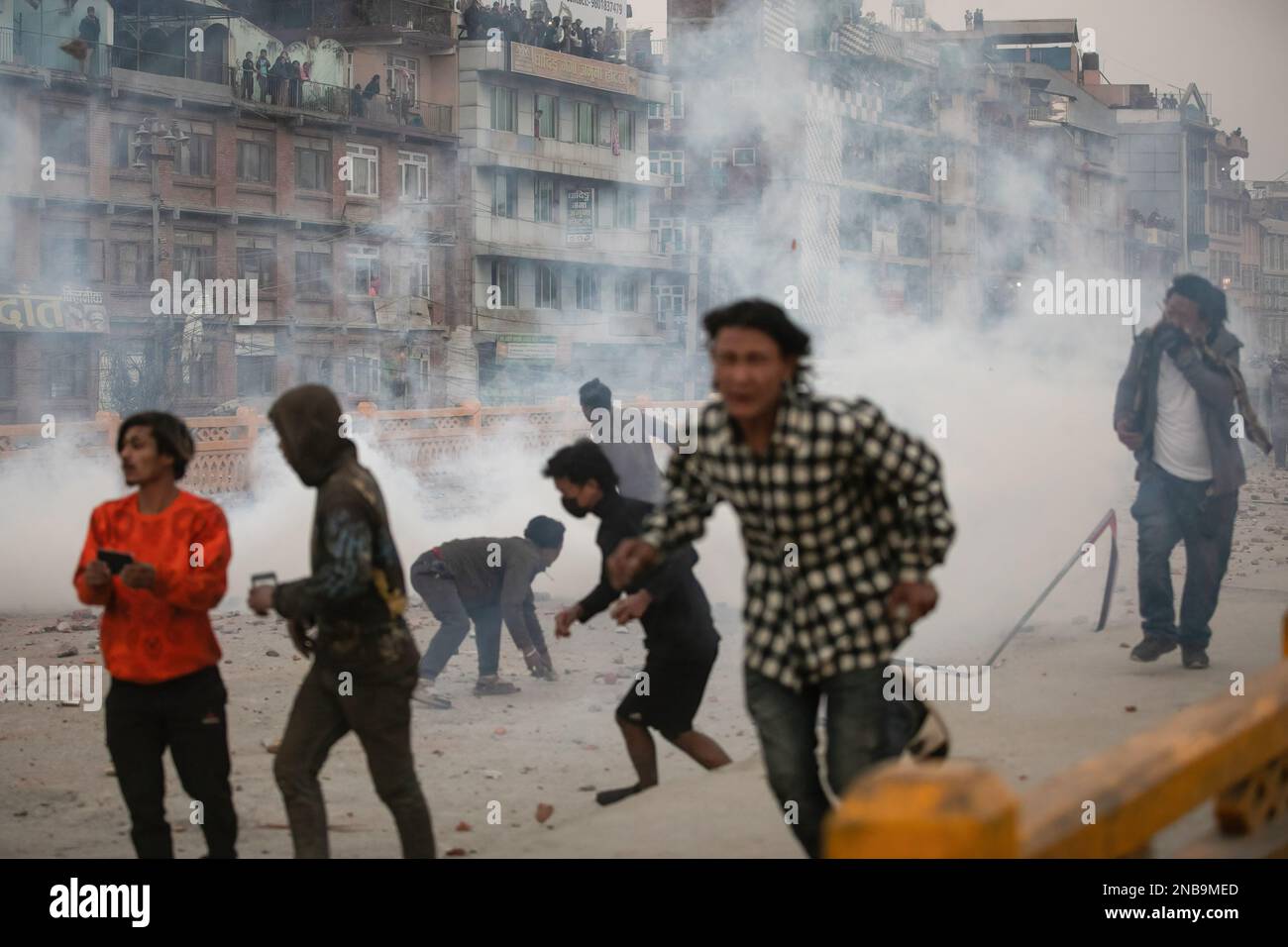 Protesters hurl bricks and stones at the riot police during a ...