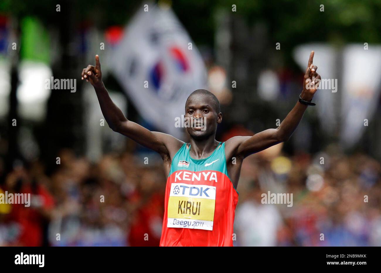Kenya's Abel Kirui celebrates as he crosses the finish line to win gold ...