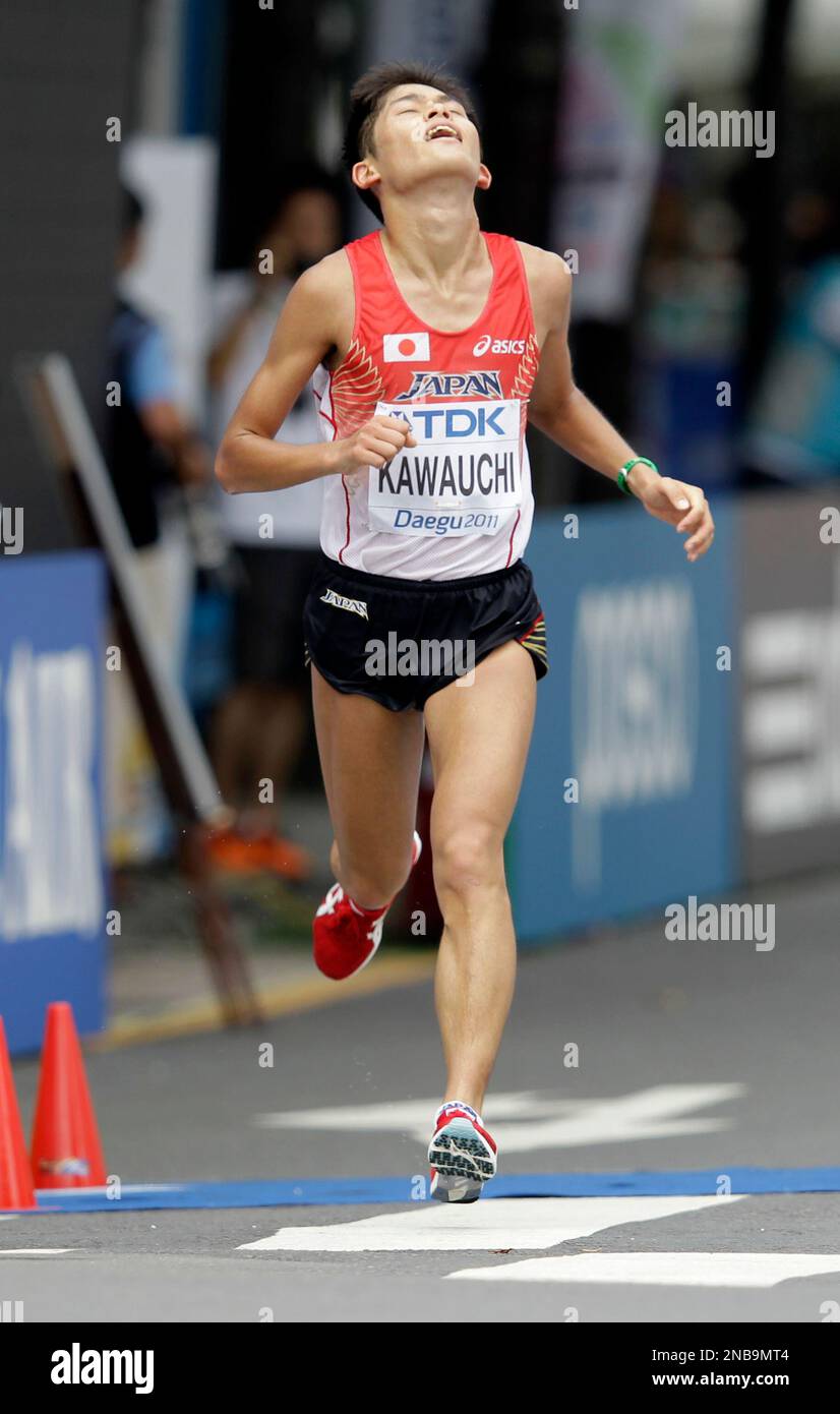 Japan's Yuki Kawauchi reacts as he crosses the finish line during the Men's Marathon at the ...