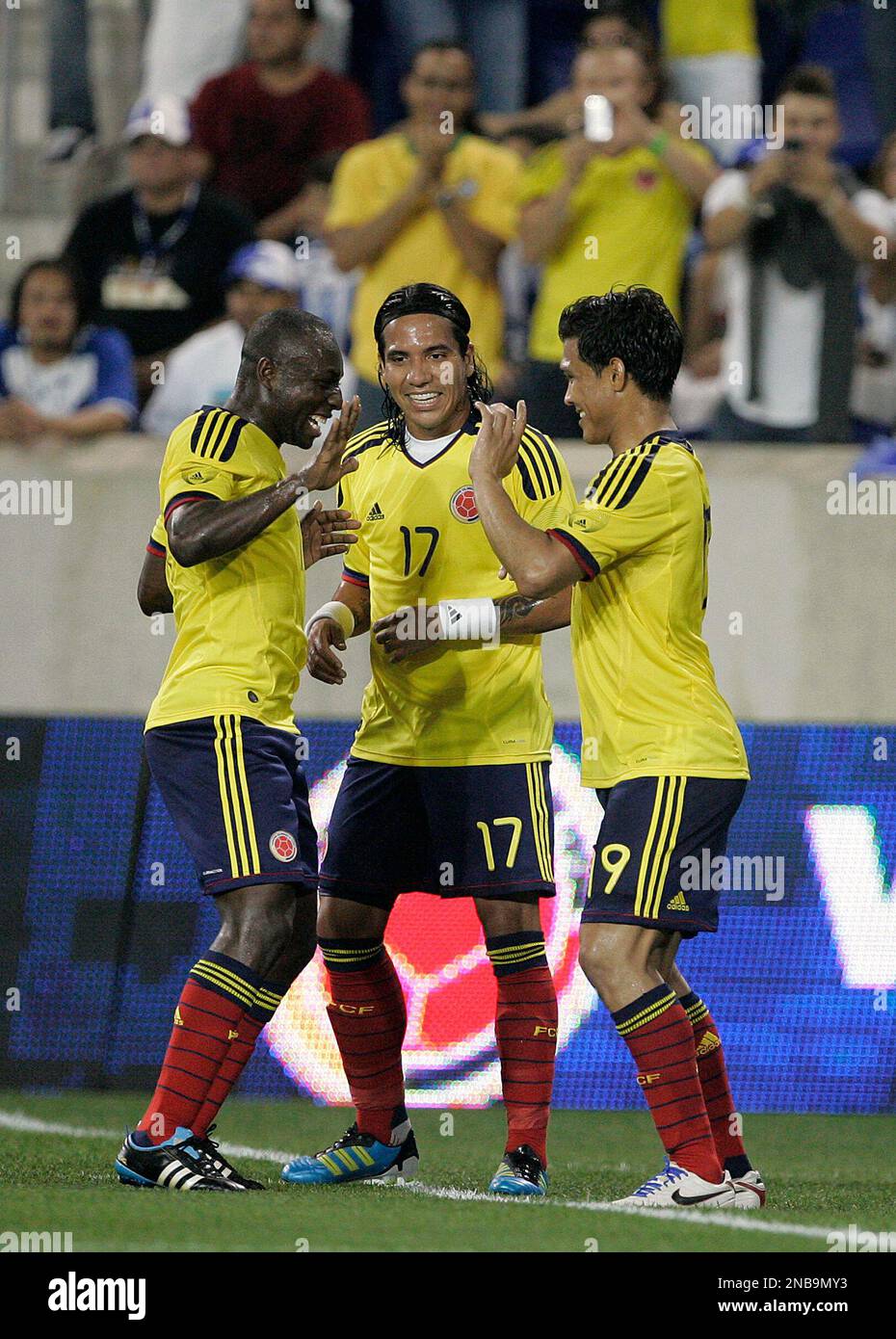 Colombia's Pablo Armero, left, and Dayro Moreno (17) congratulate ...