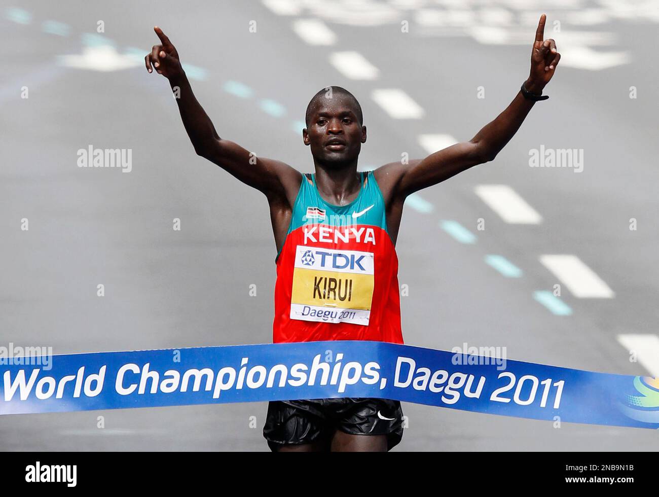 Kenya's Abel Kirui crosses the finish line to win gold during the Men's ...
