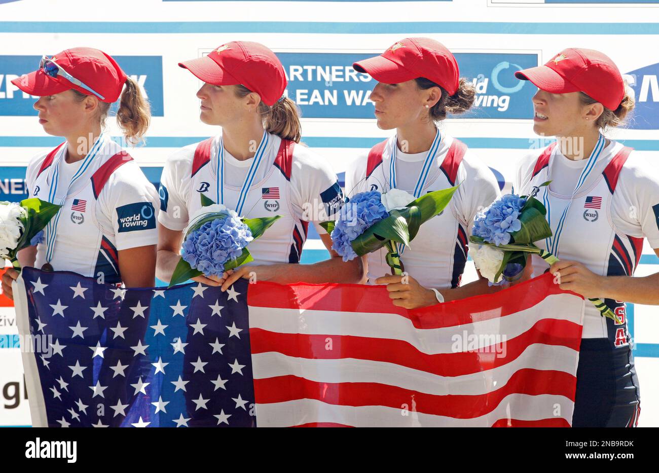 The team of the United States celebrate their third place on the podium ...