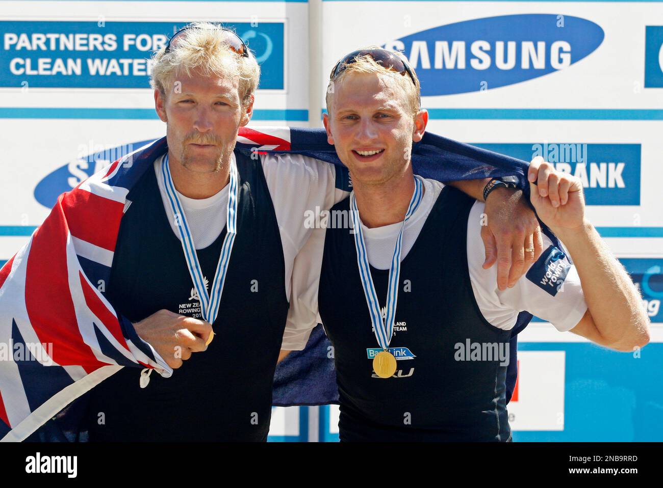 Eric Murray and Hamish Bond of New Zealand celebrate with their gold ...