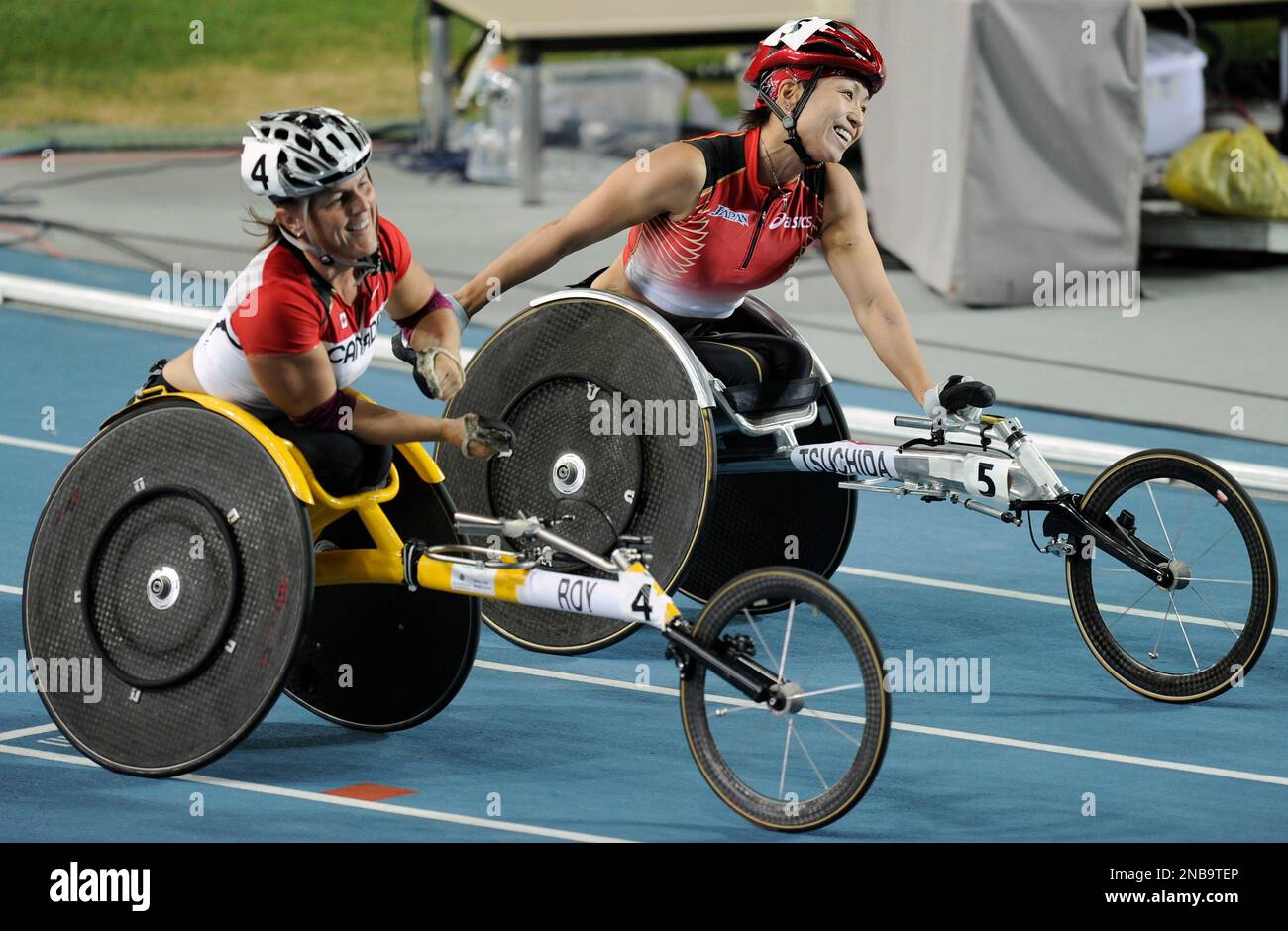 Japan's Wakako Tsuchida, right, celebrates placing second behind Canada ...