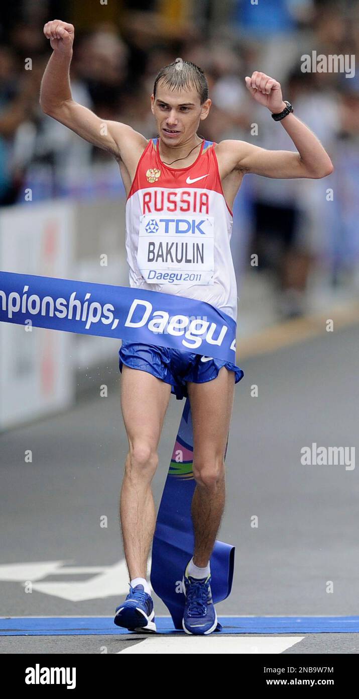 Russia's Sergey Bakulin crosses the finish line to win the Men's 50km Race Walk at the World ...