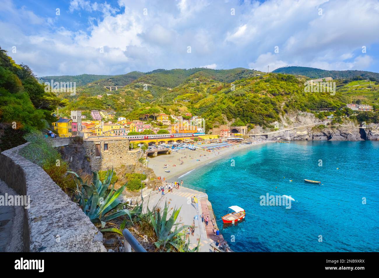View from a hillside path of the wide sandy beach at the town of ...