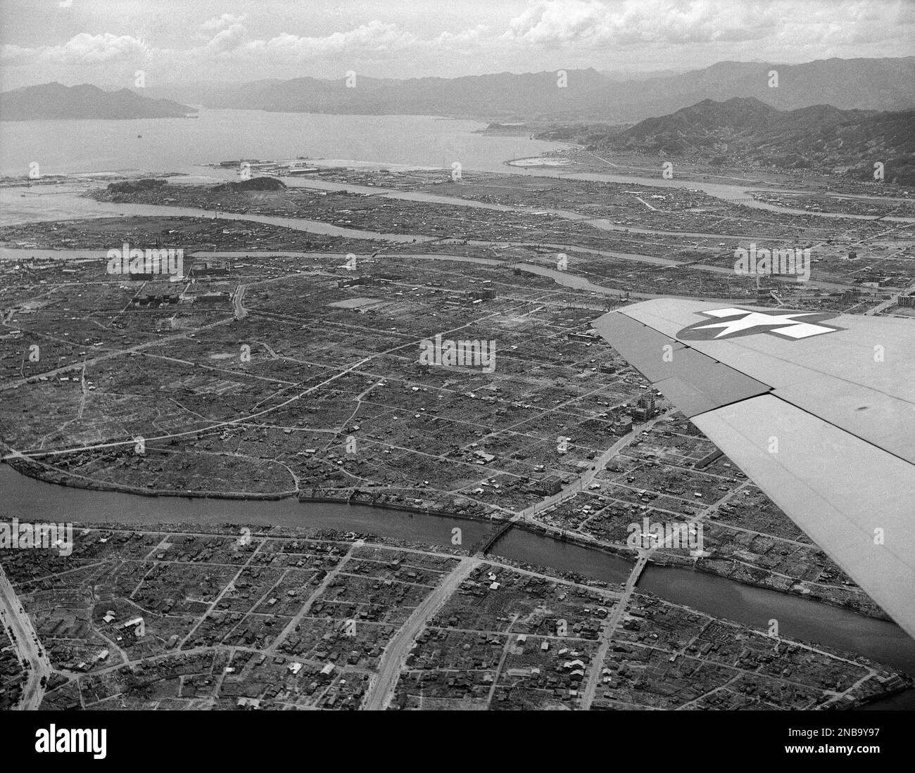 Aerial view of the city one year after the atomic bomb blast, shows ...