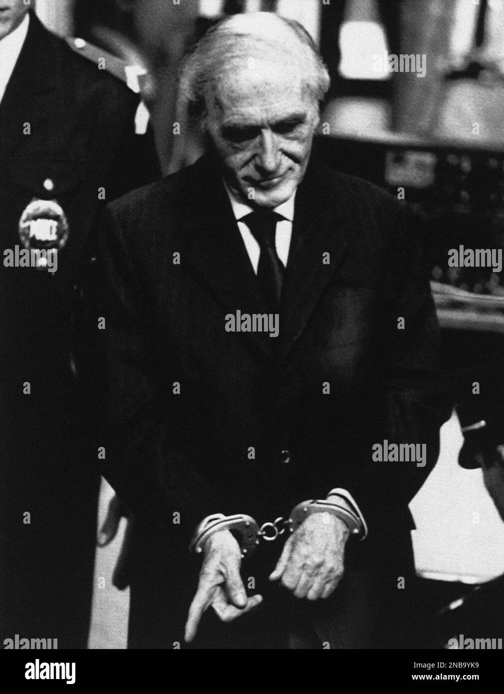 Nazi war criminal Klaus Barbie points a finger to his armchair as his ...