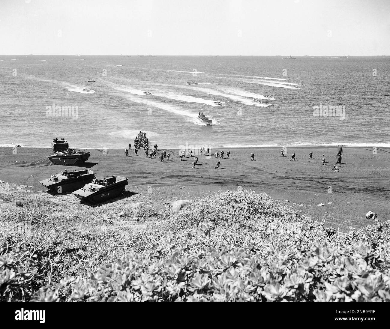 The Third U.S. Marine Division lands on the black sand beaches of Iwo ...